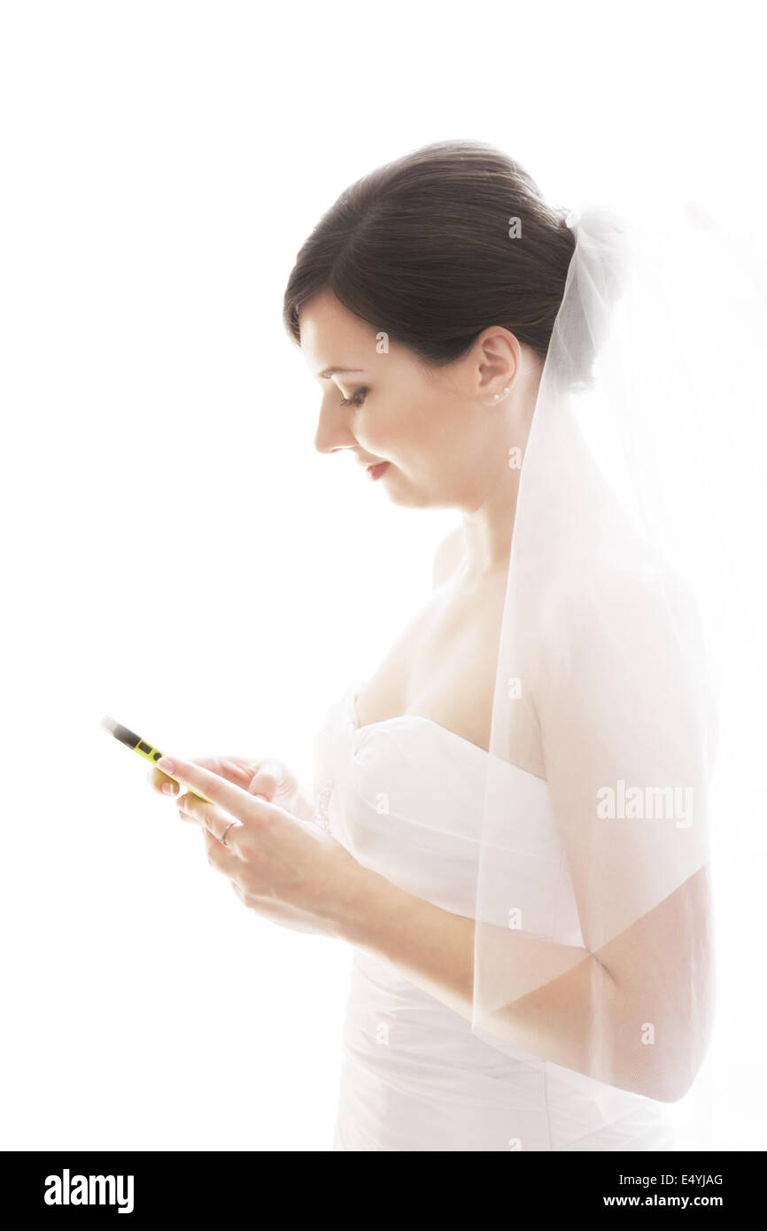 Bride with cellphone Stock Photo - Alamy