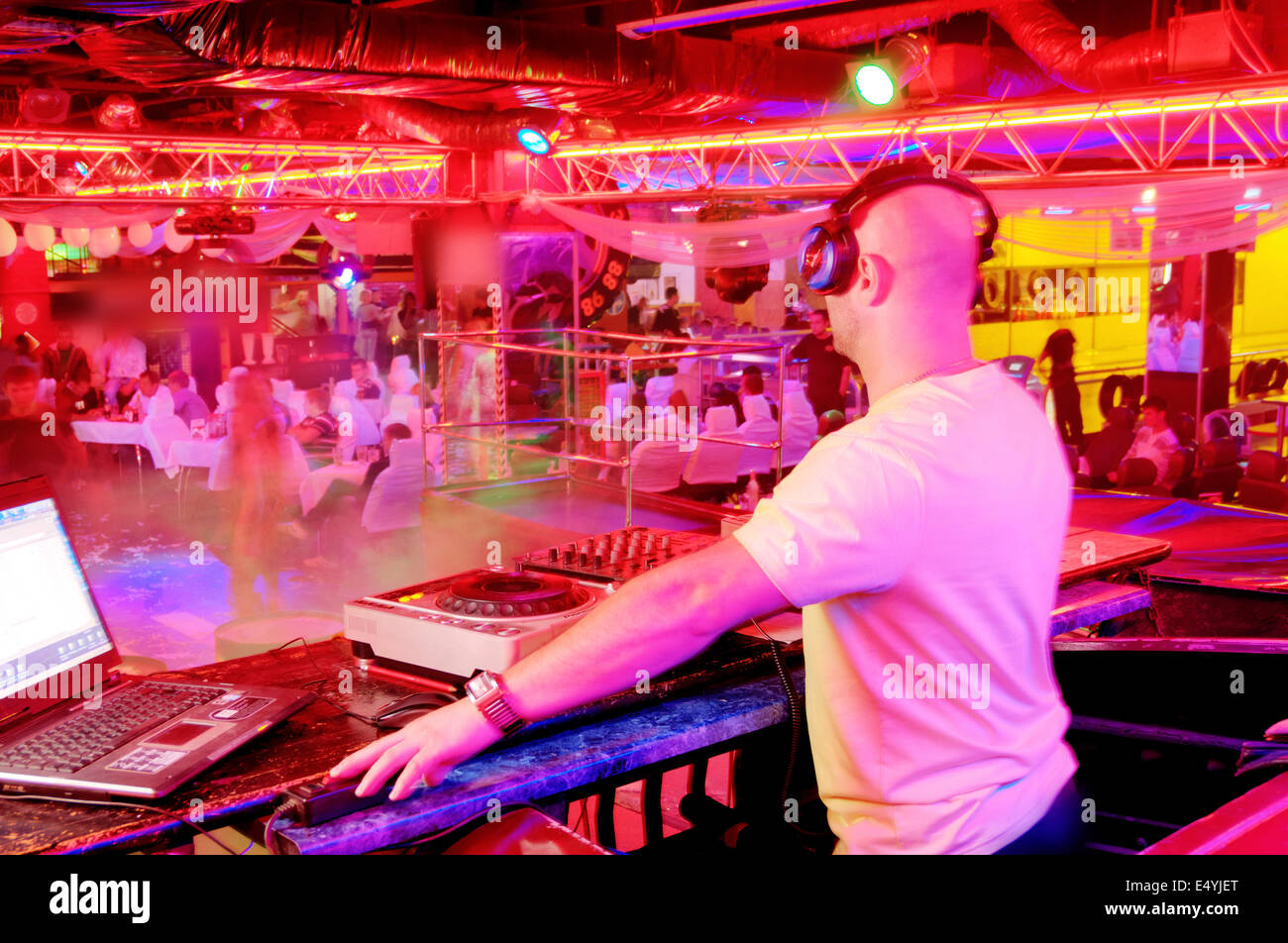 DJ behind the control panel Stock Photo - Alamy