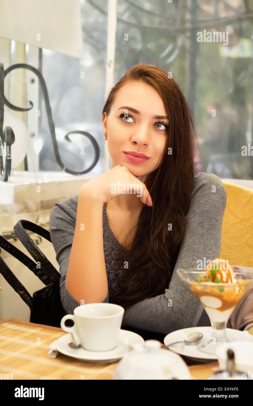 Young thoughtful woman Stock Photo - Alamy