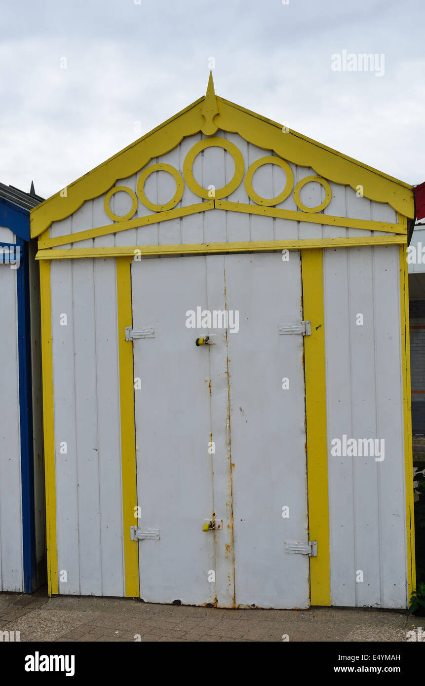 Old yellow and white beach hut Stock Photo - Alamy