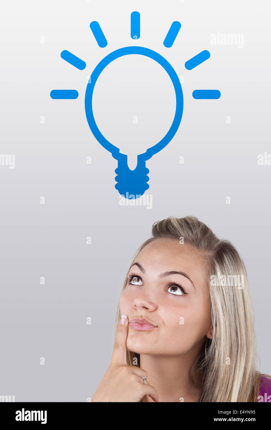 Young girl looking at idea type of sign Stock Photo - Alamy