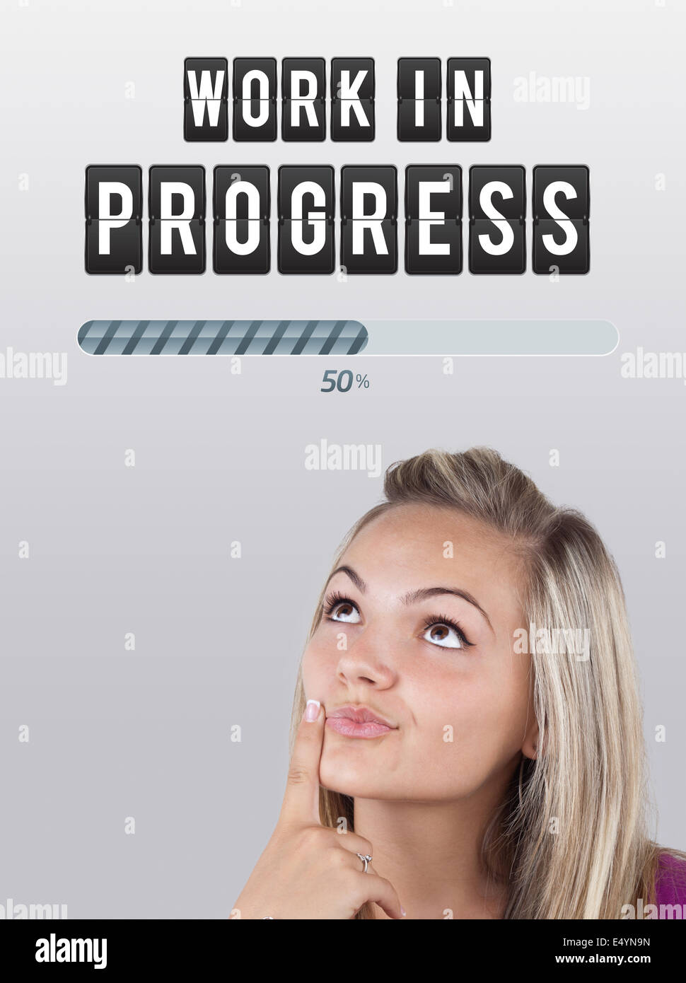 Young girl looking at idea type of sign Stock Photo - Alamy
