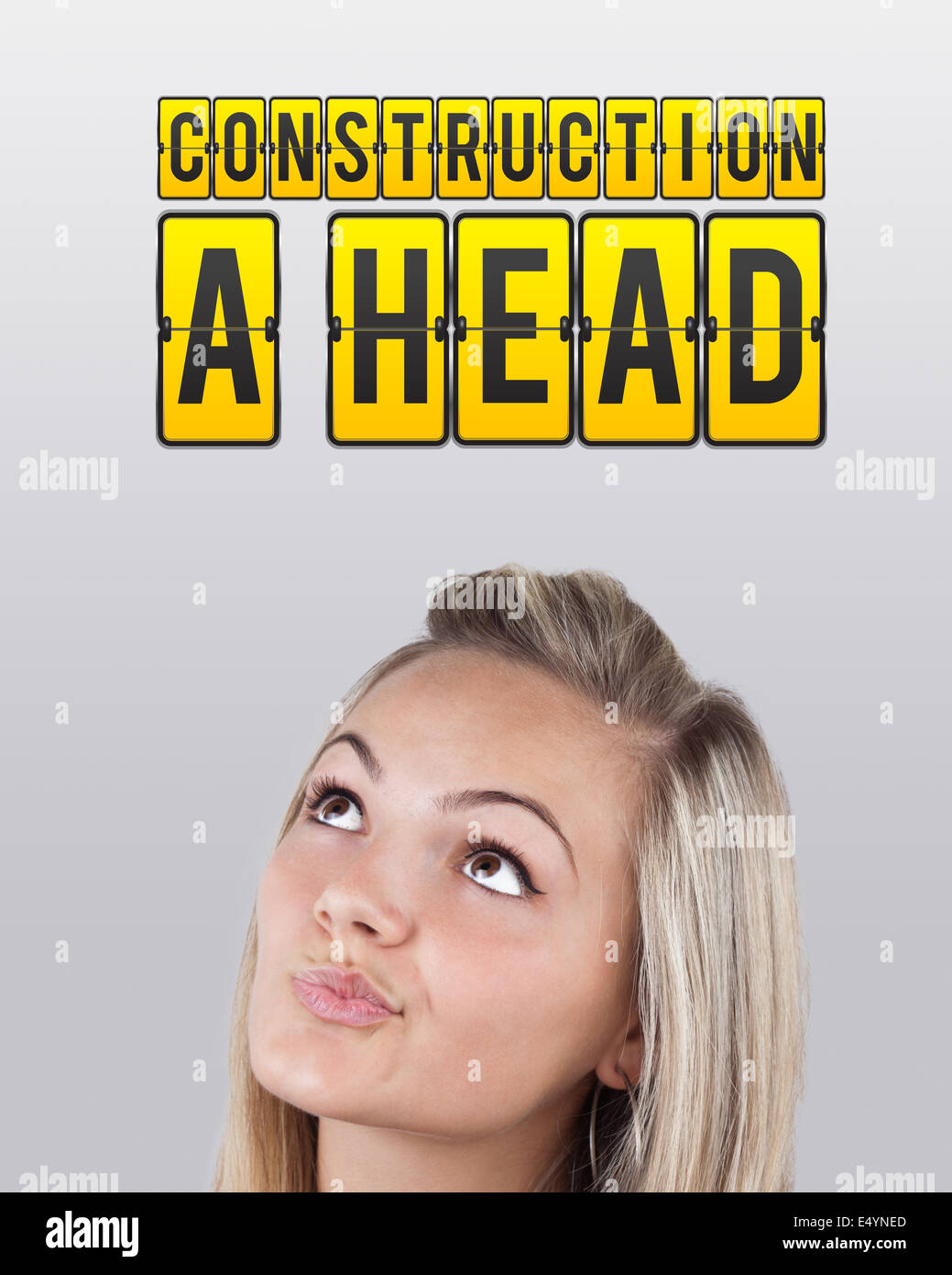 Young girl looking at idea type of sign Stock Photo - Alamy