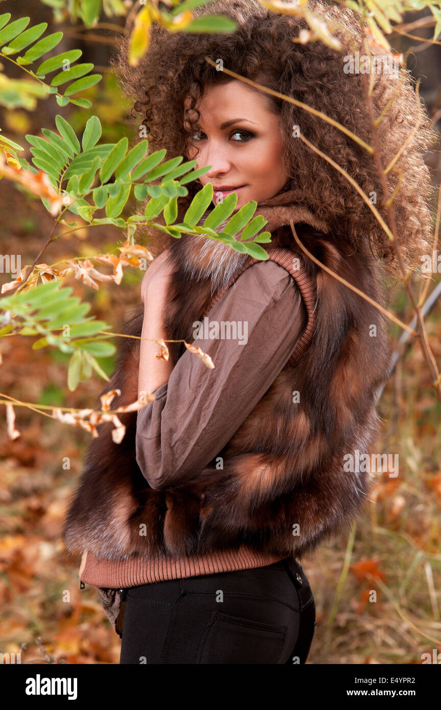 woman standing among the branches of bushes Stock Photo - Alamy