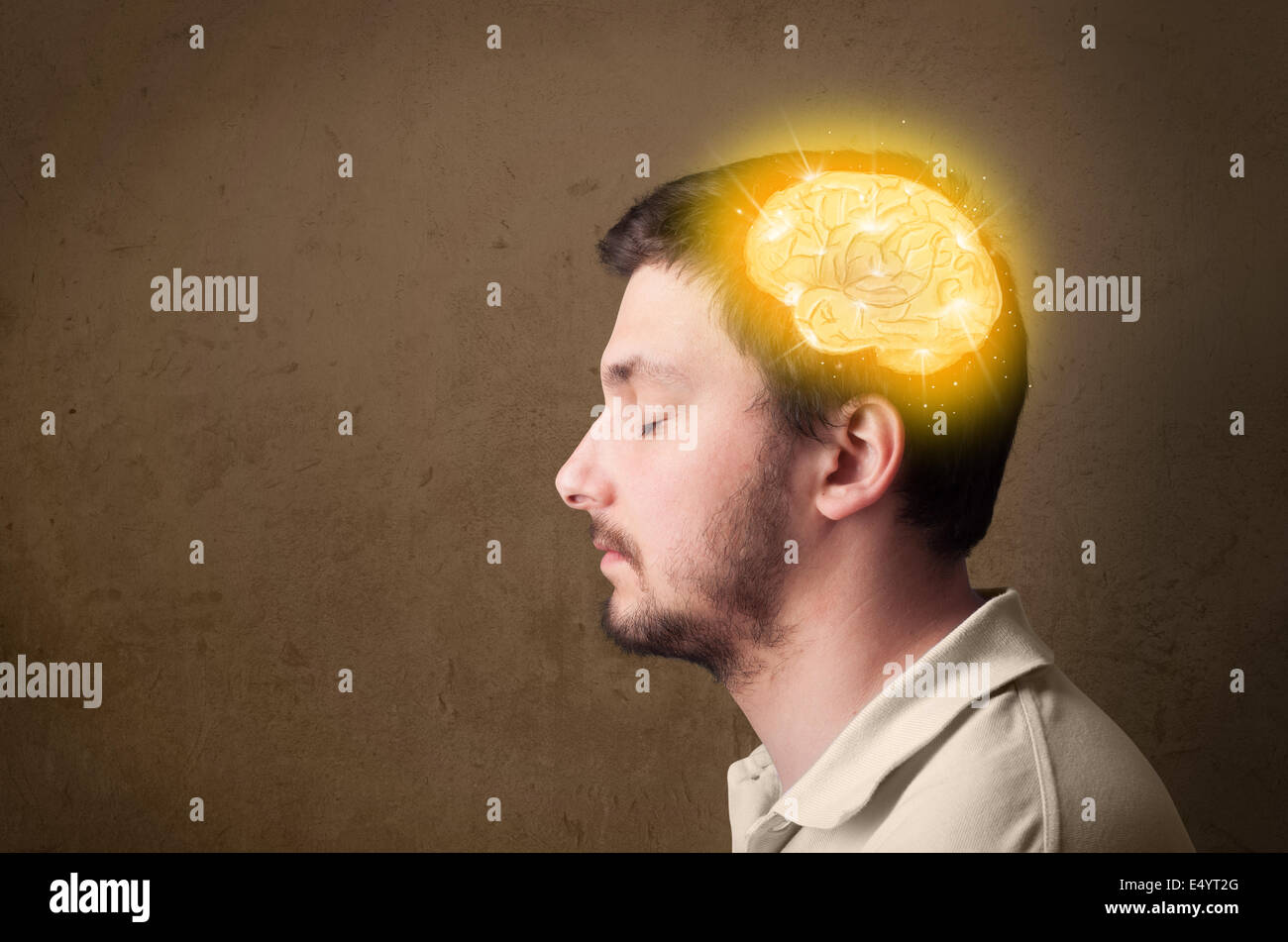 Young man thinking with glowing brain illustration Stock Photo - Alamy