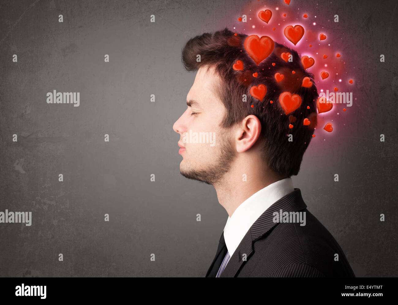 Young person thinking about love with red hearts Stock Photo - Alamy