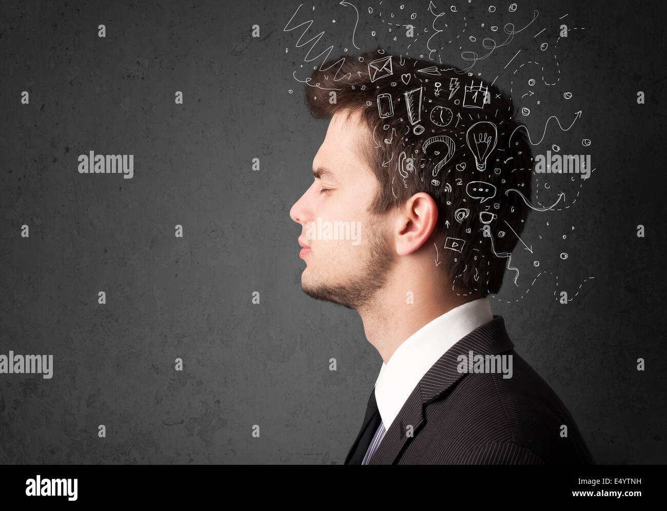Young man thinking with abstract lines and symbols Stock Photo - Alamy