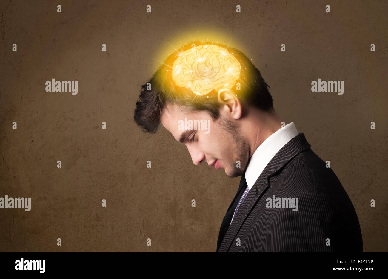 Young man thinking with glowing brain illustration Stock Photo - Alamy