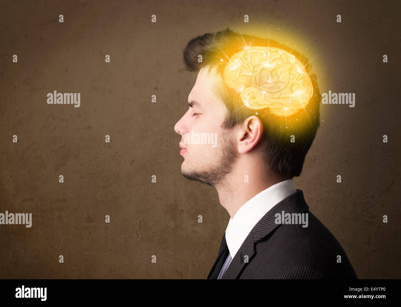 Young man thinking with glowing brain illustration Stock Photo - Alamy
