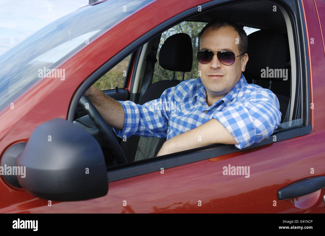 Adult man is driving his car Stock Photo - Alamy