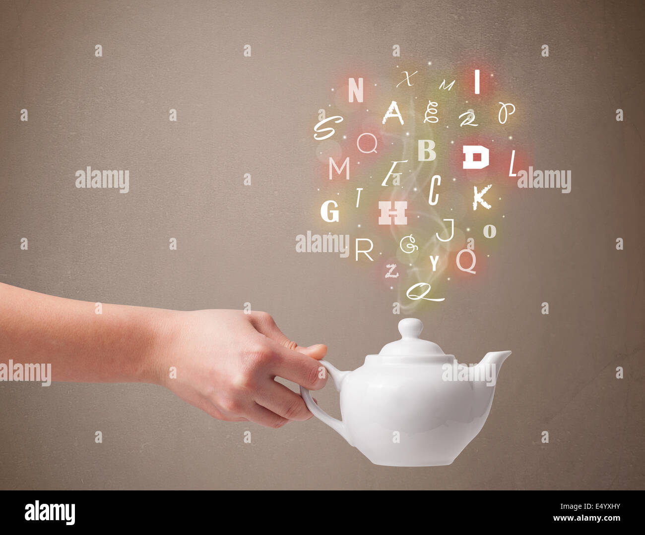 Tea pot with colorful letters Stock Photo - Alamy