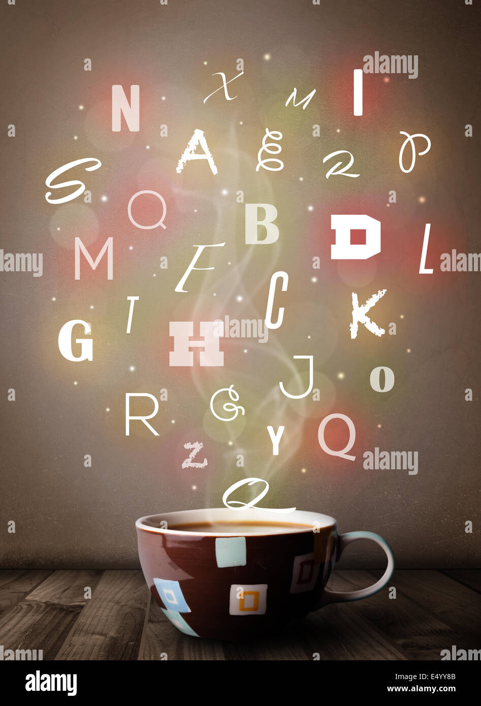 Coffee cup with colorful letters Stock Photo - Alamy