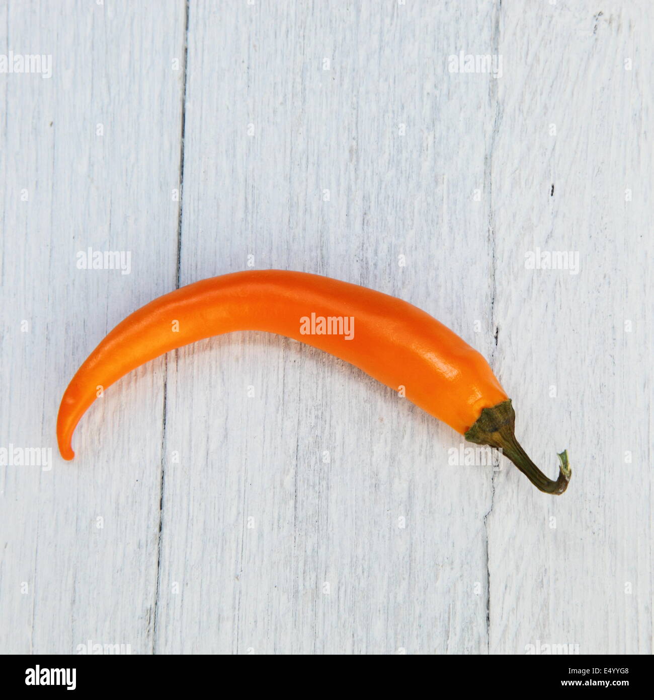 Single orange capsicum pepper Stock Photo - Alamy