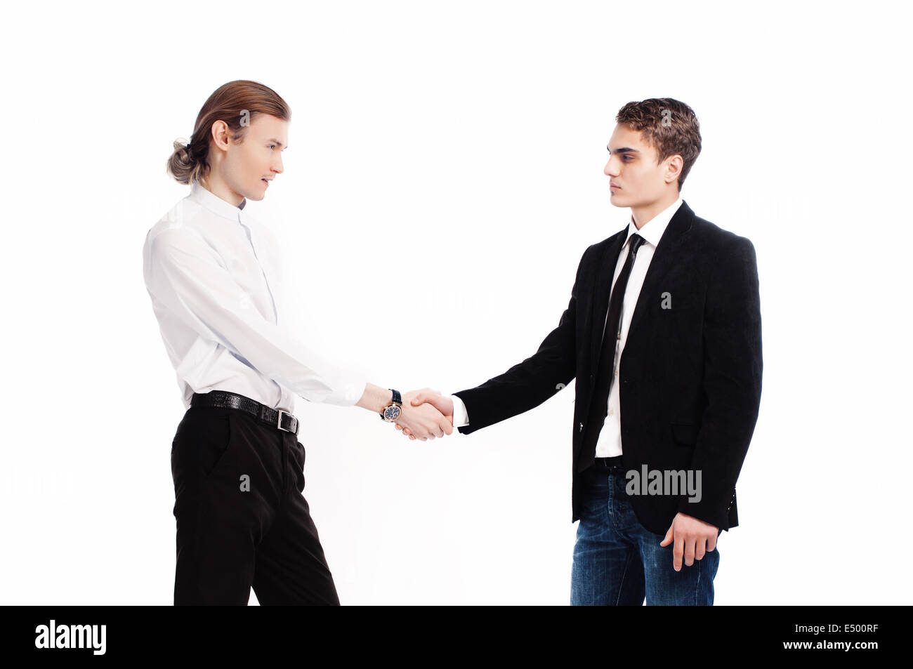 two fashionable young men greet each other Stock Photo - Alamy