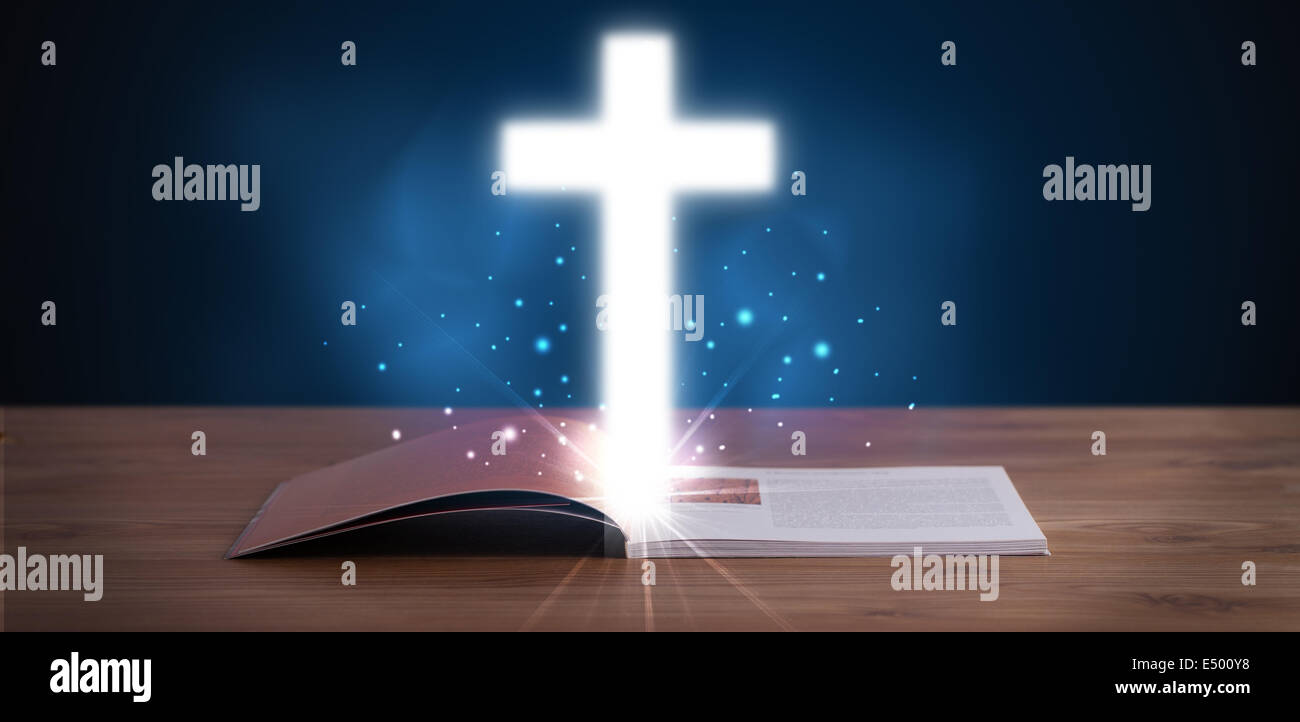 Open holy bible glowing cross hi-res stock photography and images - Alamy