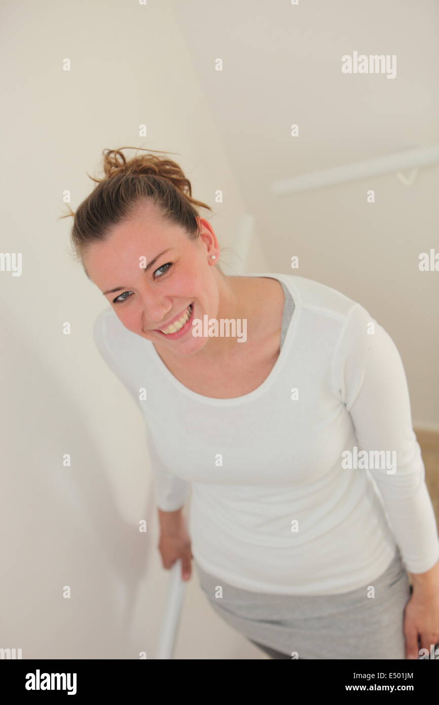 Woman looking up standing high angle hi-res stock photography and ...