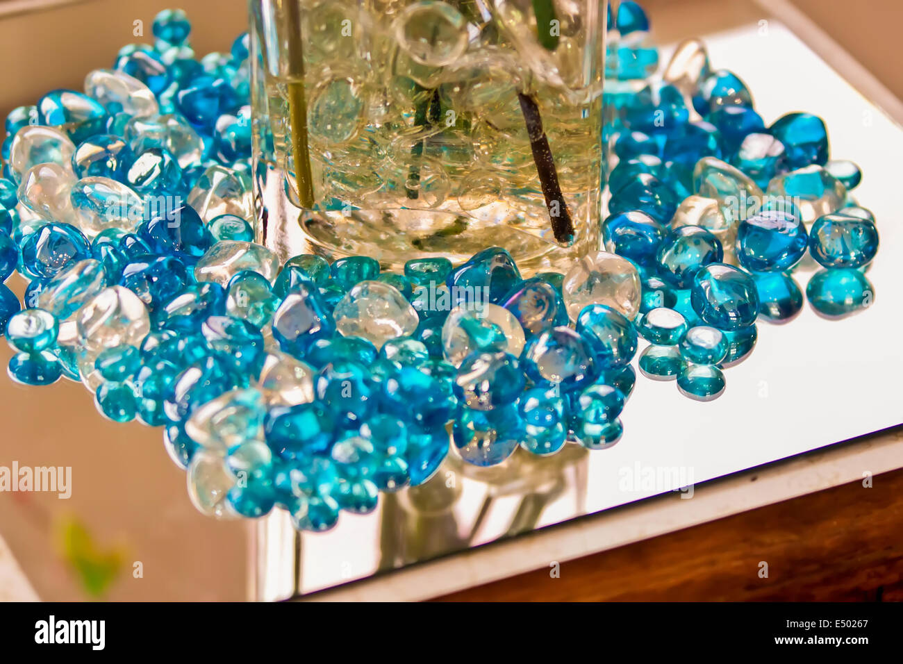 Blue marbles on reflective surface hi-res stock photography and images ...