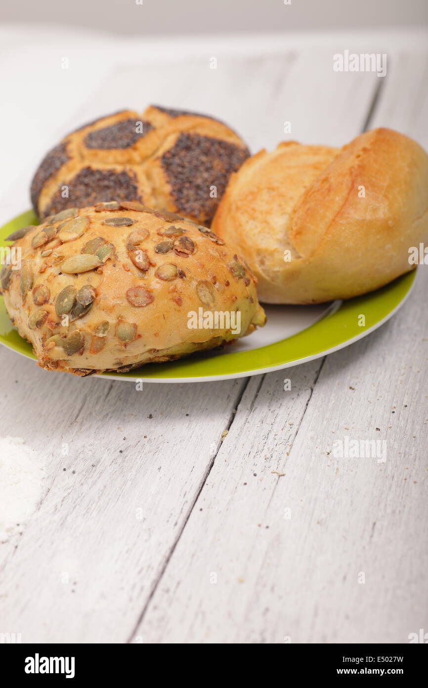Three assorted rolls on a plate Stock Photo - Alamy