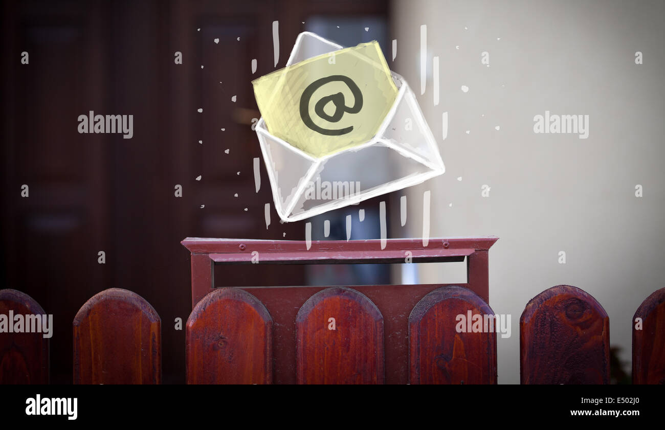 Envelope with email sign dropping into mailbox Stock Photo - Alamy