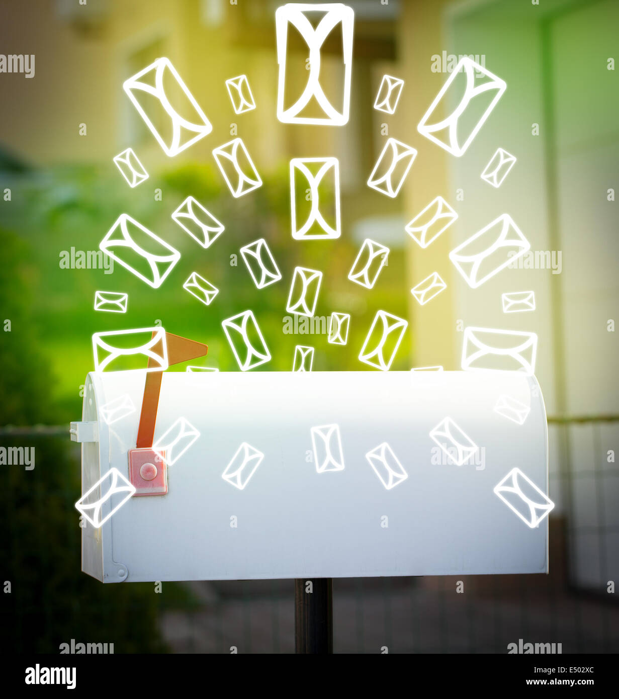 Mailbox with letter icons on glowing green background Stock Photo - Alamy