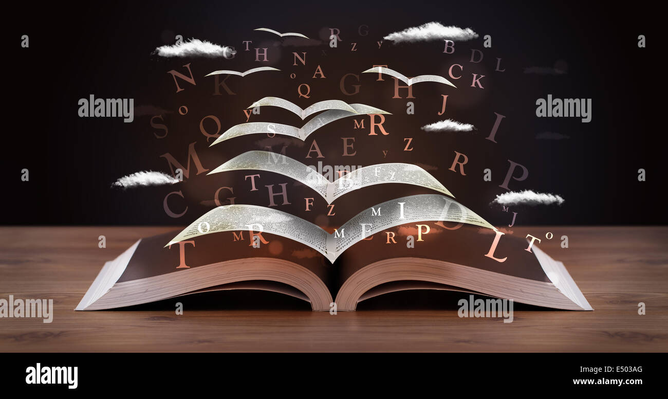 Pages and glowing letters flying out of a book Stock Photo - Alamy