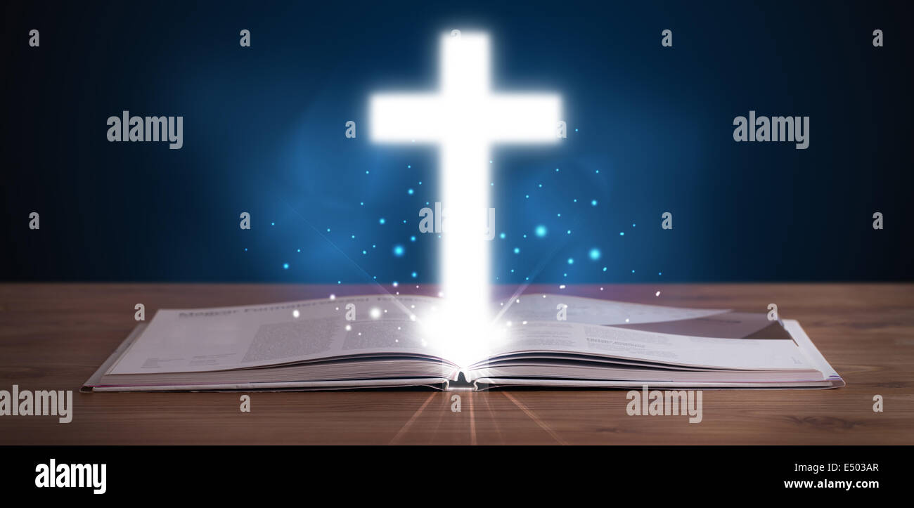 Open holy bible glowing cross hi-res stock photography and images - Alamy