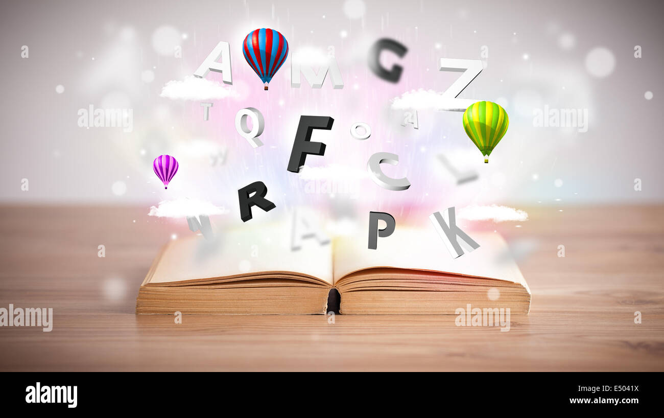 Open book with flying 3d letters on concrete background Stock Photo - Alamy