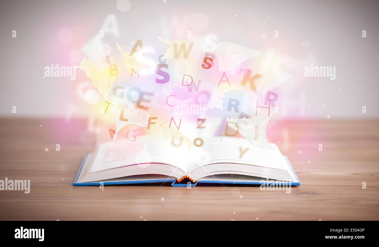 Open book with glowing letters on concrete background Stock Photo - Alamy