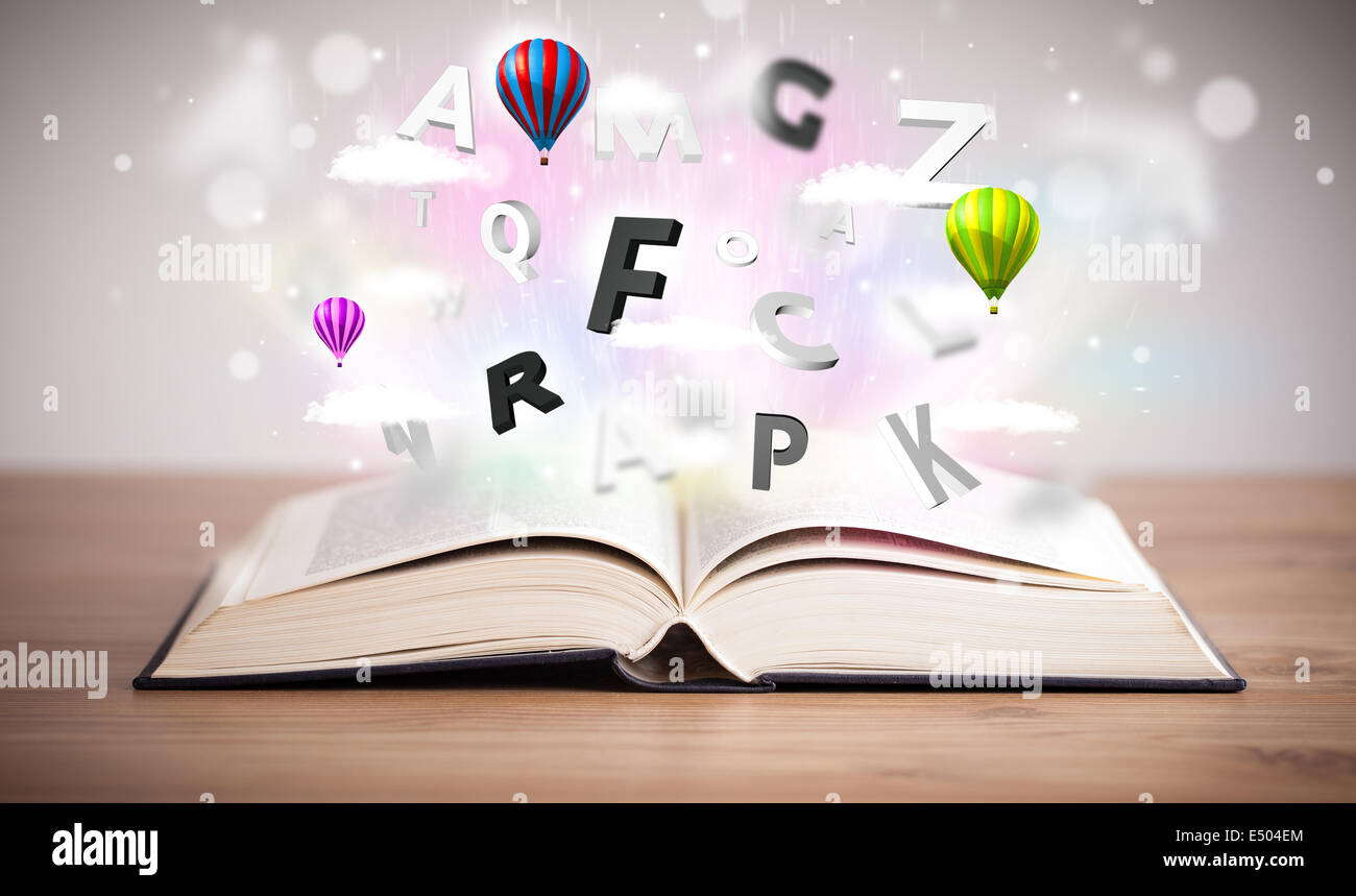 Open book with flying 3d letters on concrete background Stock Photo - Alamy