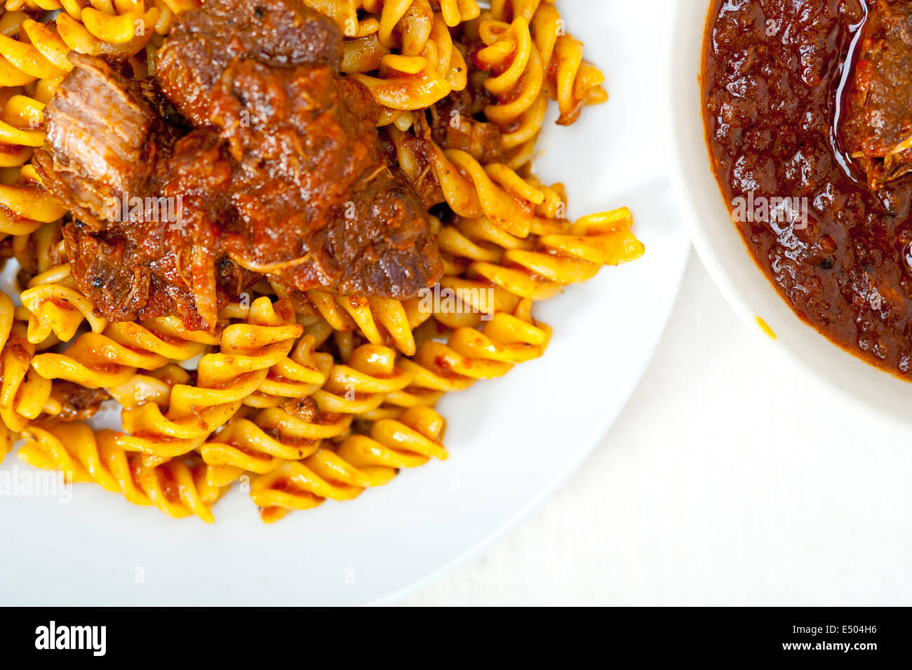 fusilli pasta with neapolitan style ragu meat sauce Stock Photo - Alamy