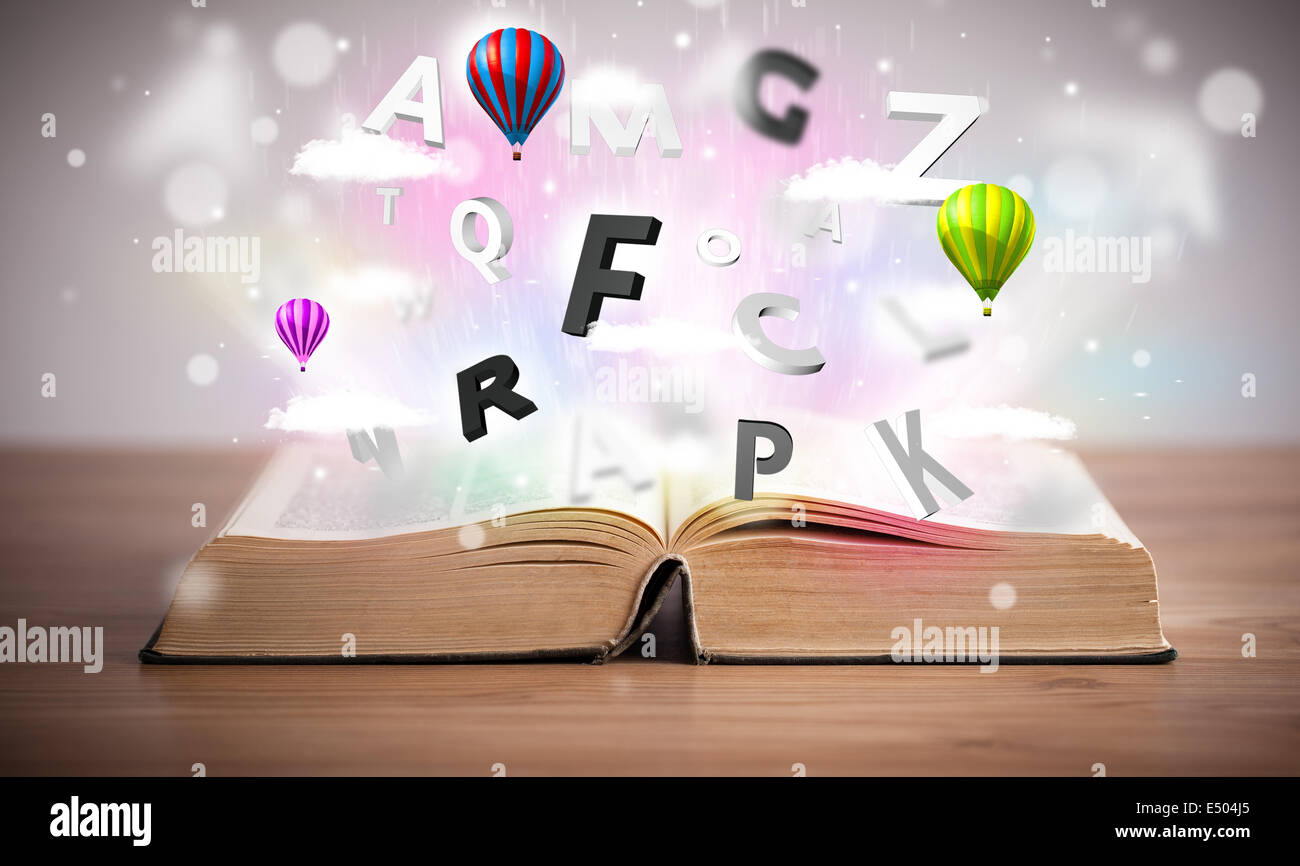 Open book with flying 3d letters on concrete background Stock Photo - Alamy