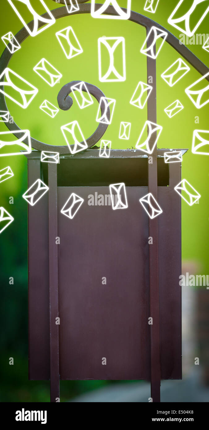 Mailbox with letter icons on glowing green background Stock Photo - Alamy