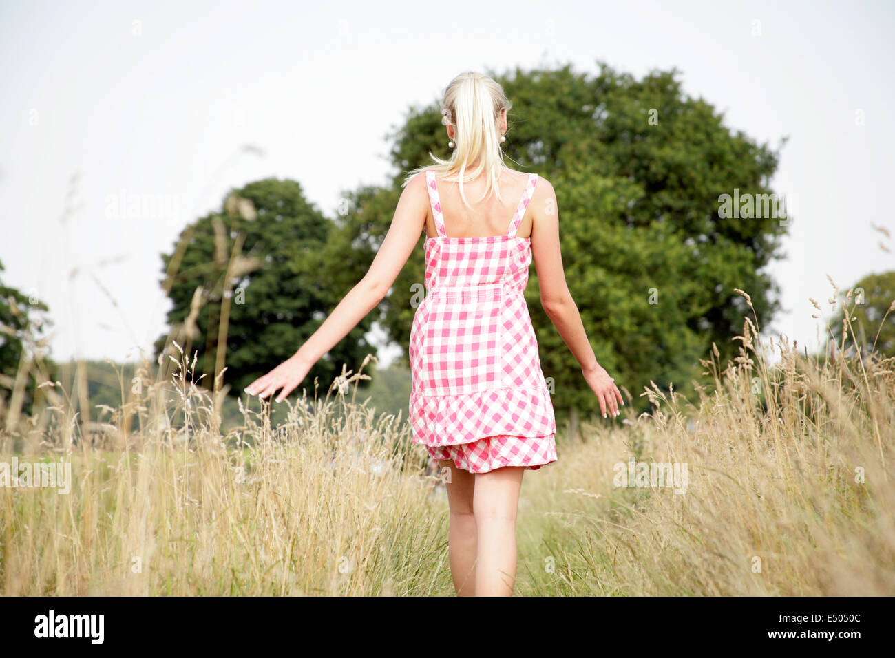 Back view of young woman Stock Photo - Alamy