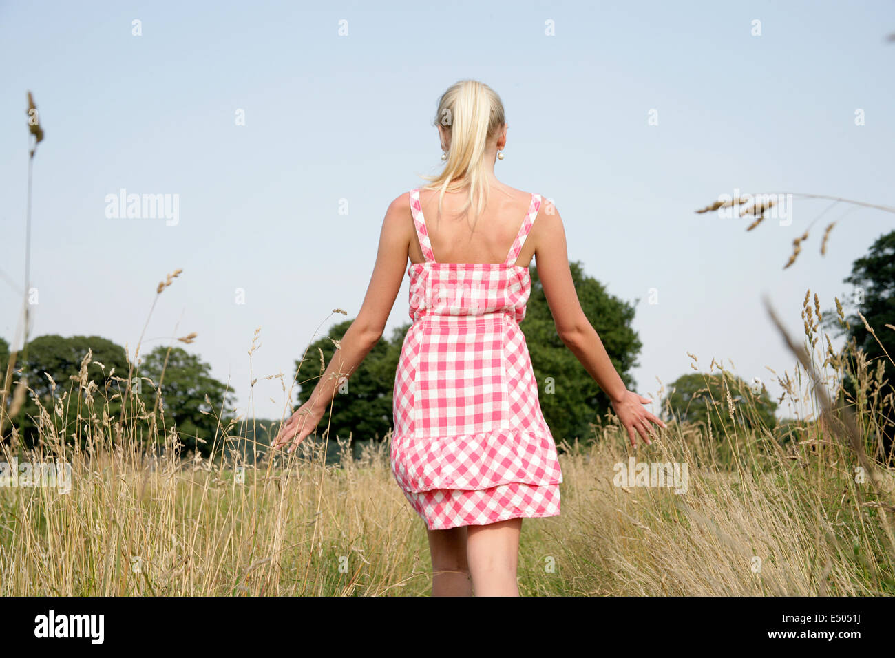 Back view of young woman Stock Photo - Alamy