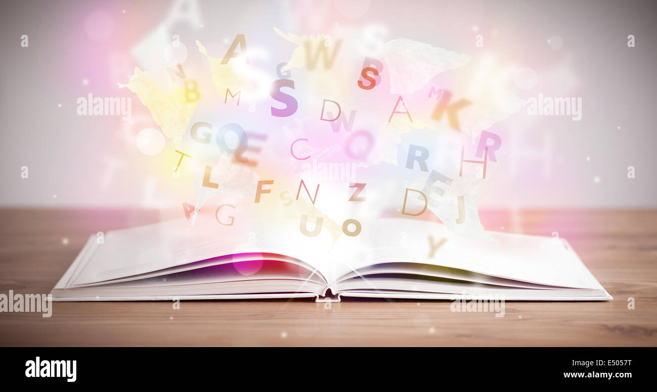 Open book with glowing letters on concrete background Stock Photo - Alamy
