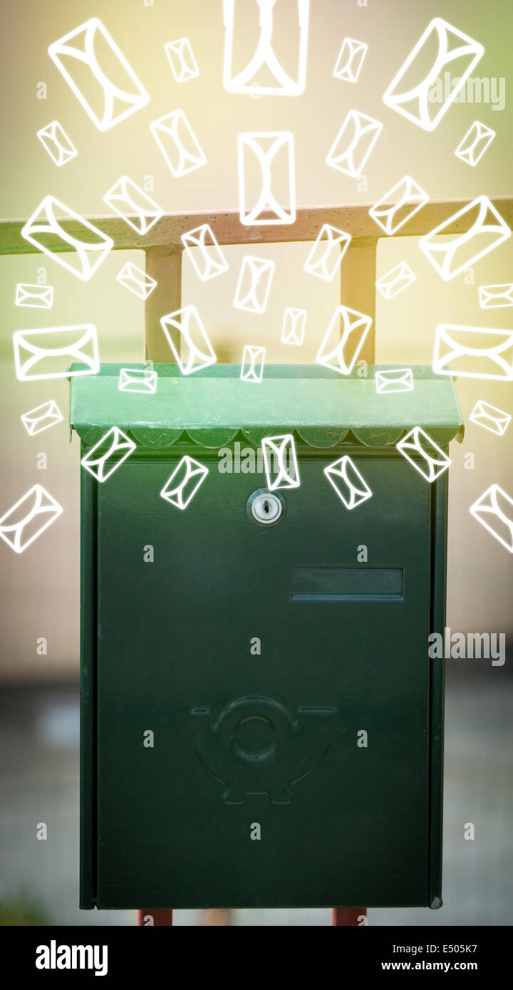 Mailbox with letter icons on glowing green background Stock Photo - Alamy