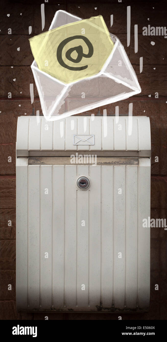Envelope with email sign dropping into mailbox Stock Photo - Alamy