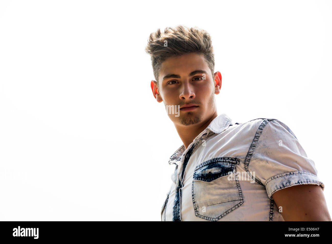 Portrait of handsome, confident young man looking at camera, isolated ...