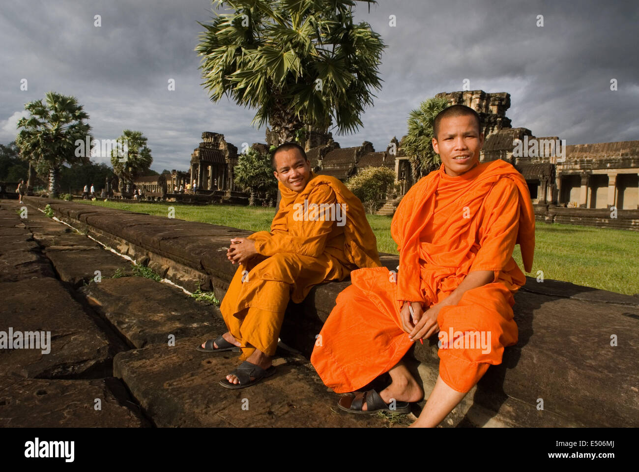 Two Buddhist monks on the outside of the Temple of Angkor Wat. Angkor ...