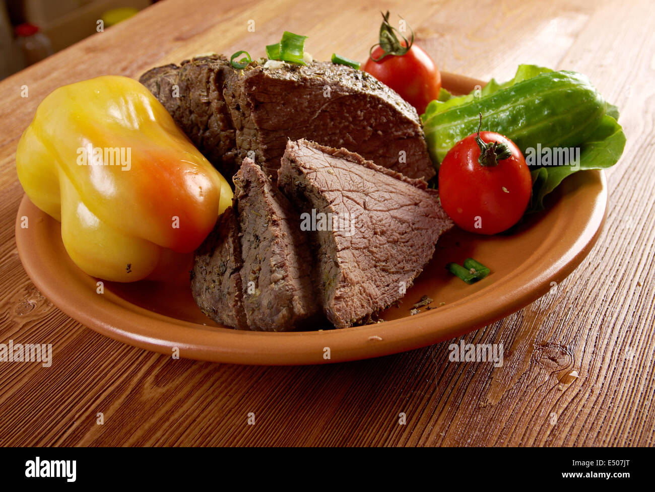 sliced rare roast beef farm-style Stock Photo - Alamy