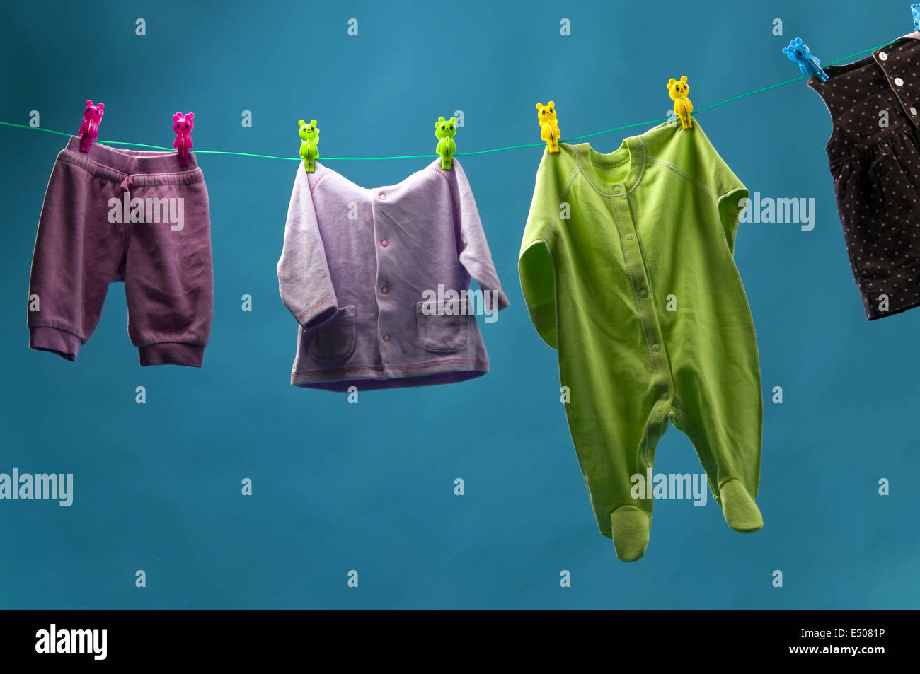 children's clothing hanging on a rope Stock Photo - Alamy