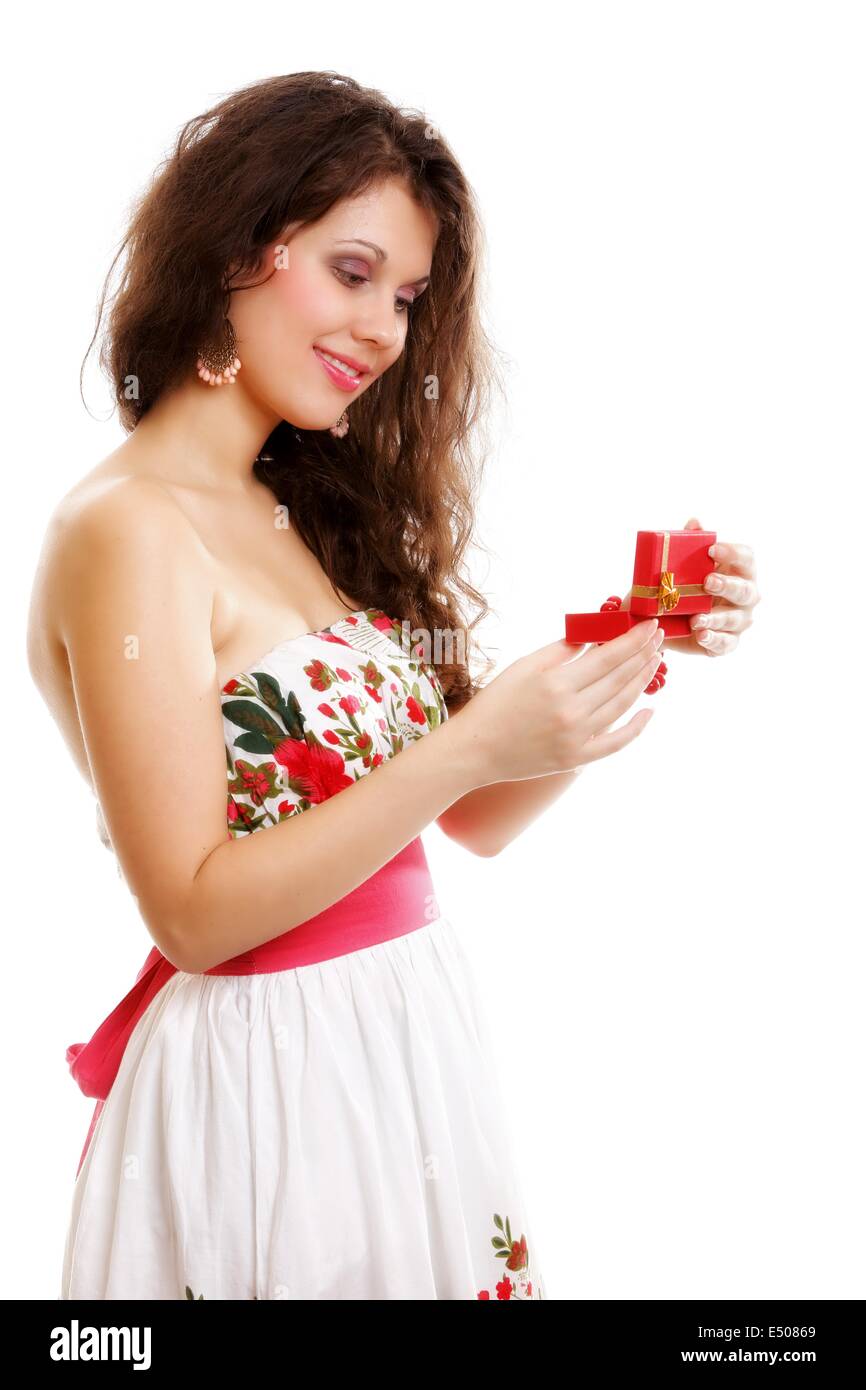 Girl opening small red gift box isolated Stock Photo - Alamy