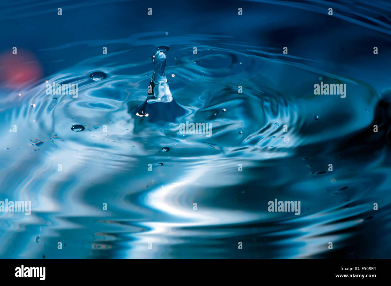 blue multi colored water drop bubbling Stock Photo - Alamy