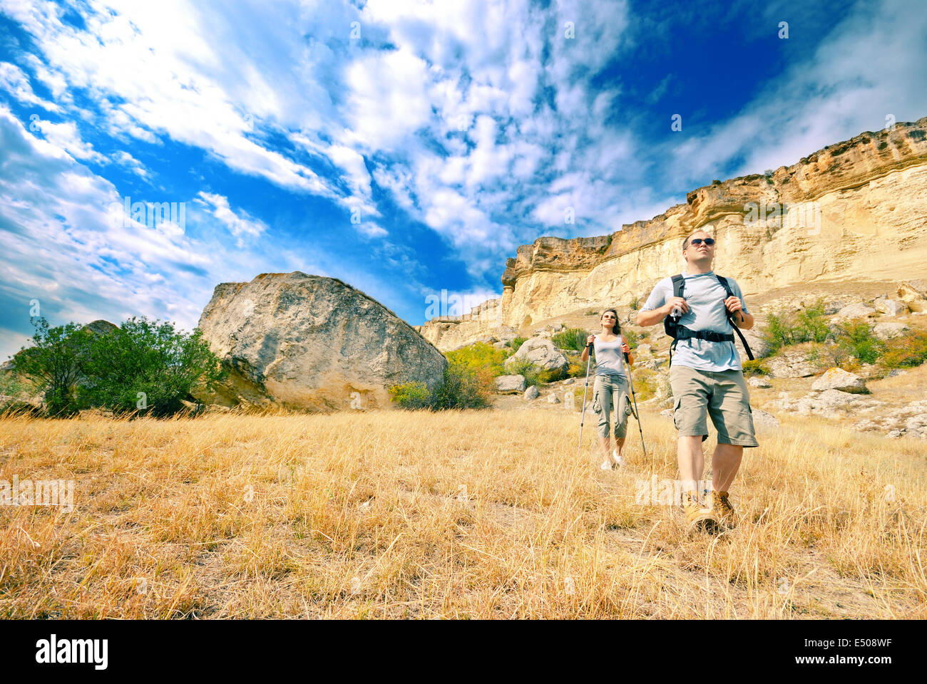 Adult man and woman are hiking Stock Photo - Alamy