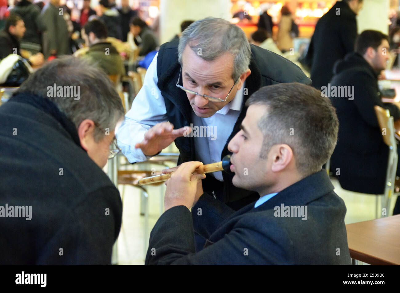 Man learn to play on Turkish ney flute in Mevlana Cultural Center ...