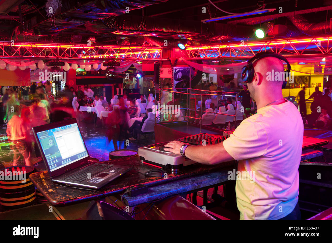 DJ behind the control panel Stock Photo - Alamy