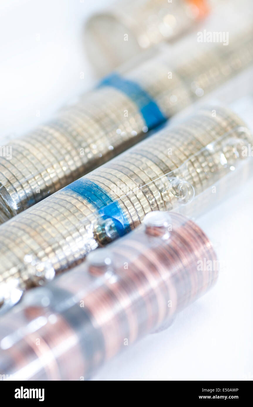 Roll of coins picture over white background. Euros Stock Photo - Alamy