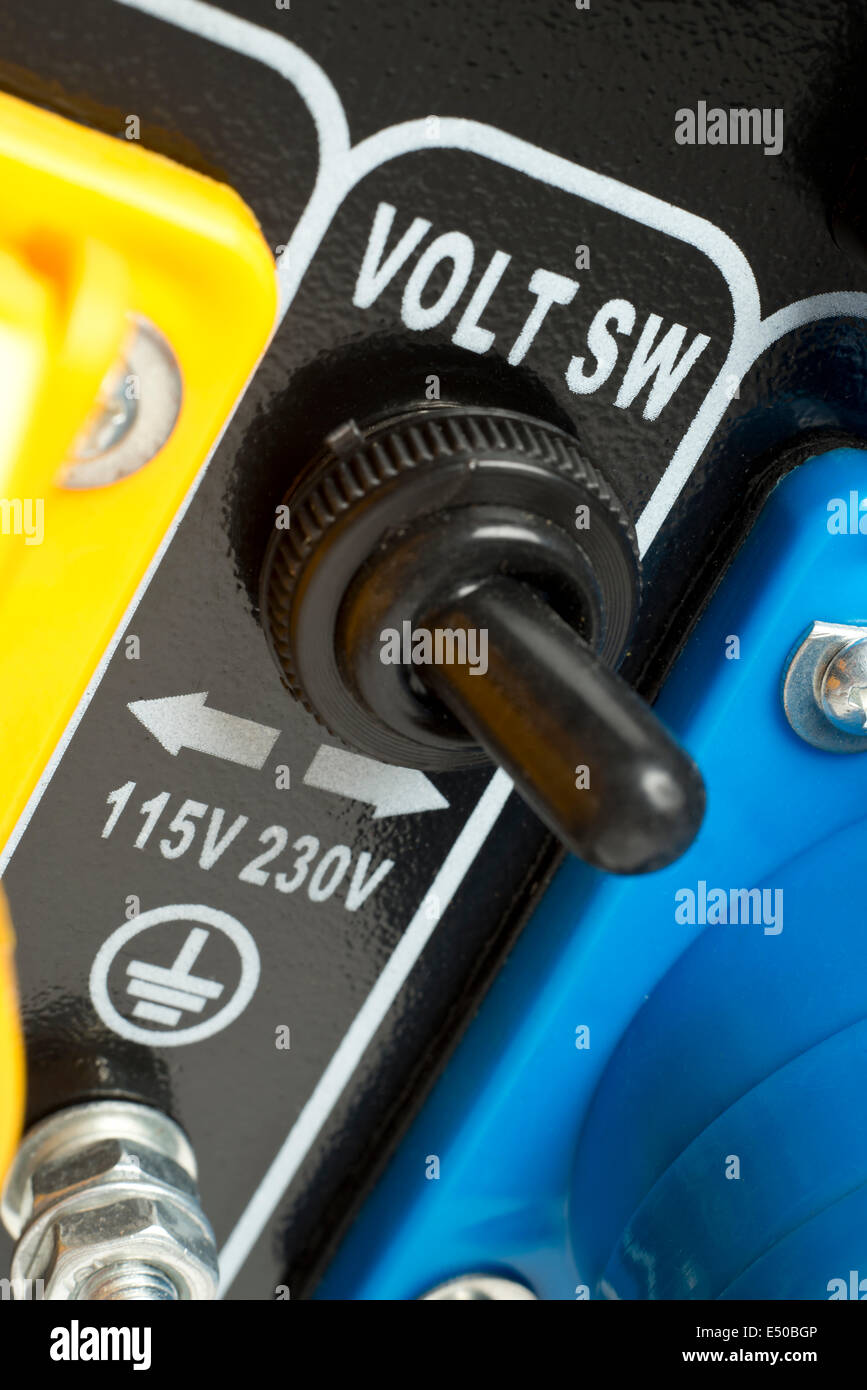 Electrical switch between 110v and 230v and Earth Stock Photo - Alamy