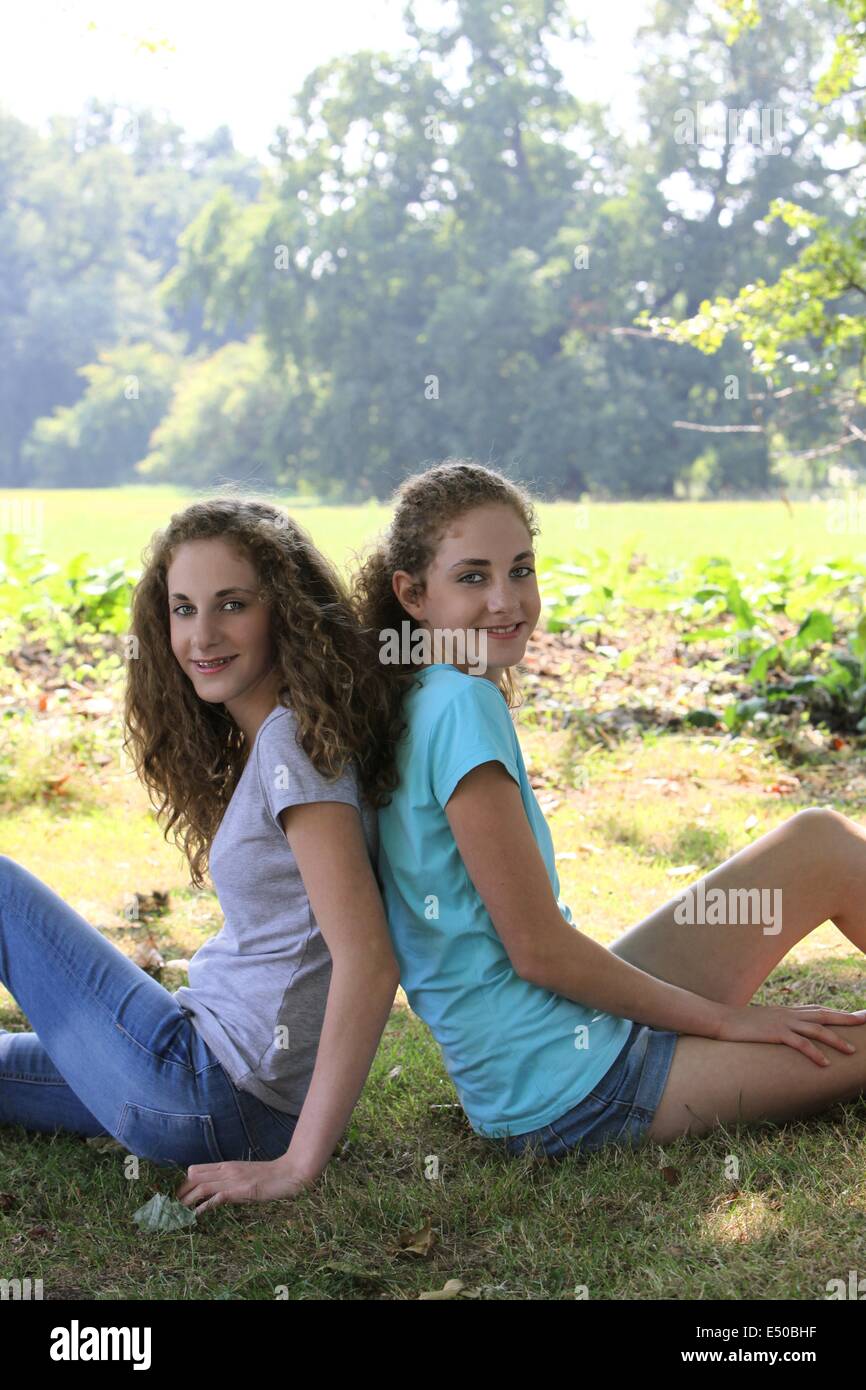 Two beautiful young girls in the park Stock Photo - Alamy
