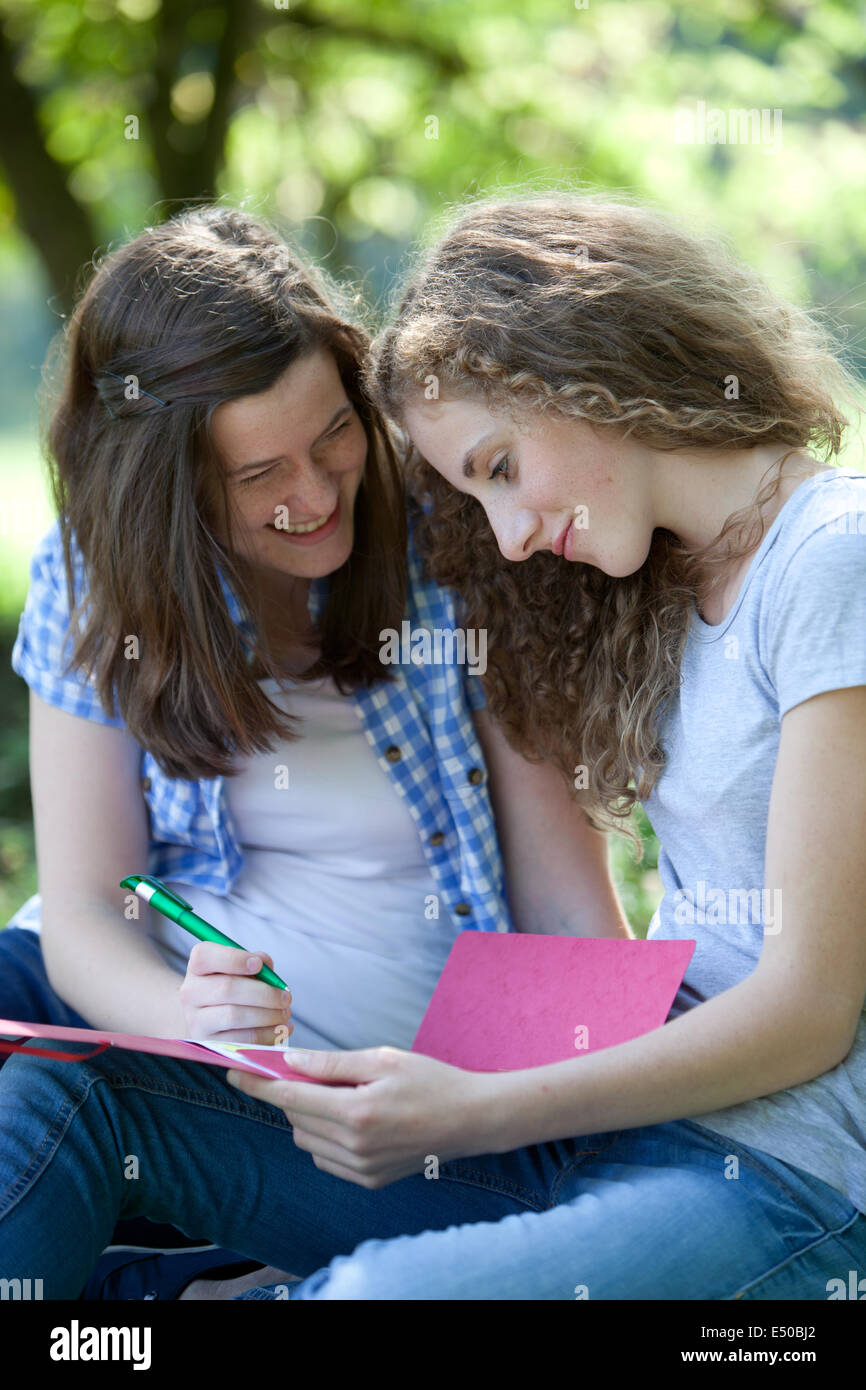 Happy college students working together Stock Photo - Alamy